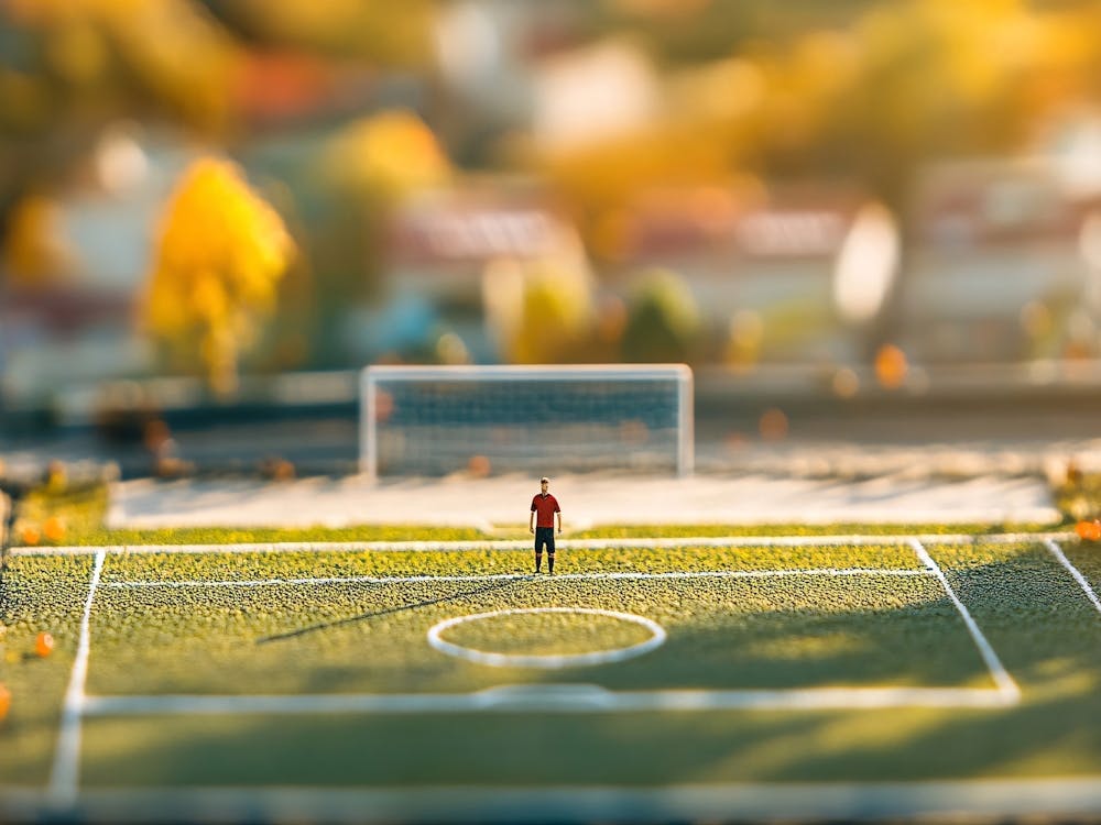 Miniature Soccer Player Standing On The Soccer Field Art Print by ...