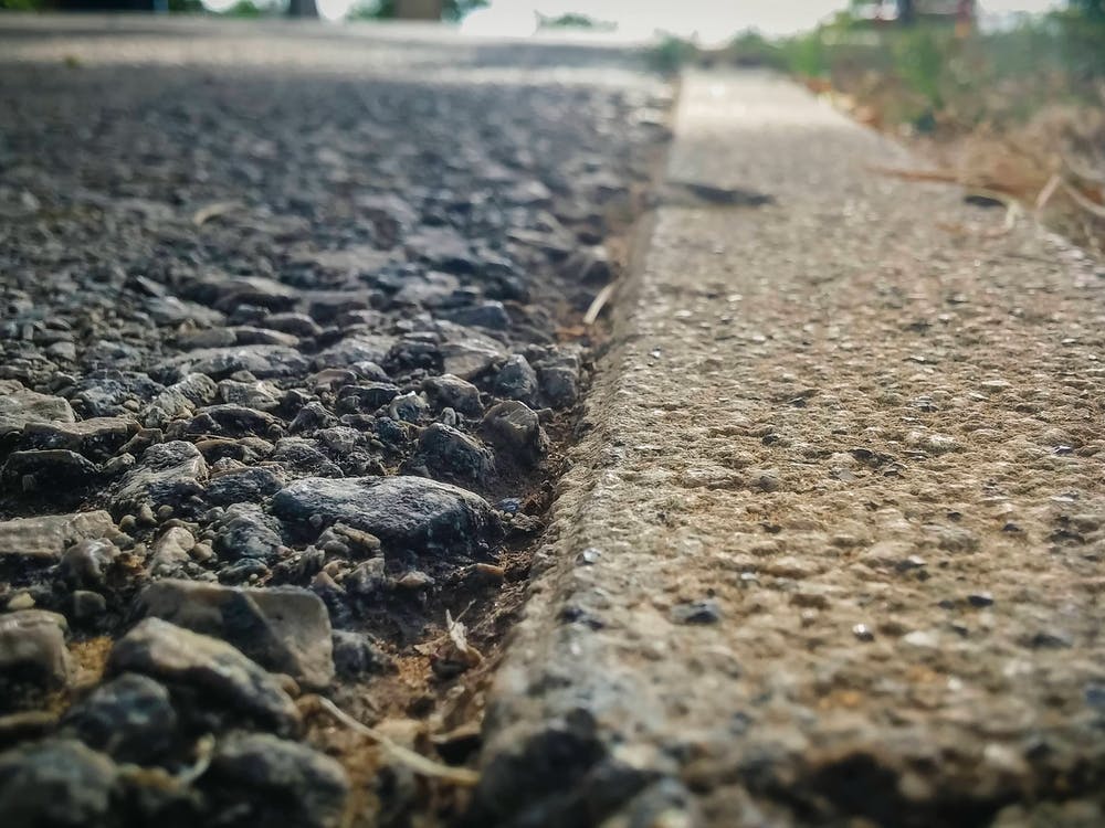Asphalt Sidewalk Close Up On Sunny Day Art Print by Picxel Perfection ...