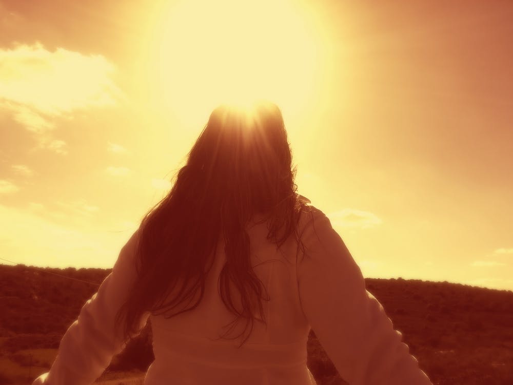 Woman Experiencing A Spiritual Moment Standing In The Sun Art Print by ...