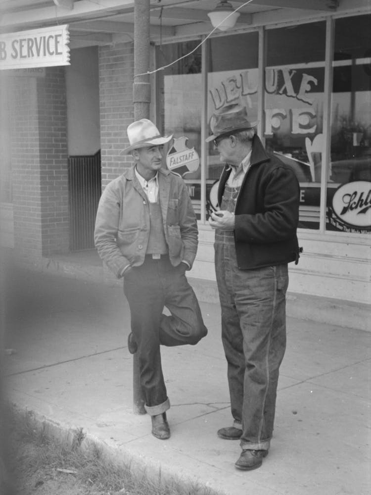 Men Talking On Sidewalks Of Sinton, Texas By Russell Lee Art Print by ...