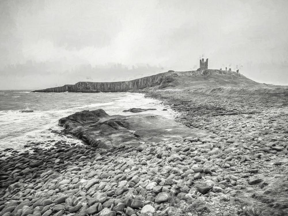 Dunstanburgh Castle Across Rocky Beach Art Print by Paul J Bucknall – Fy!