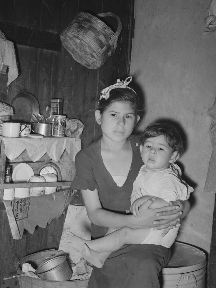 Mexican Girl With Baby Brother In Corner Of Room In Which The Entire ...