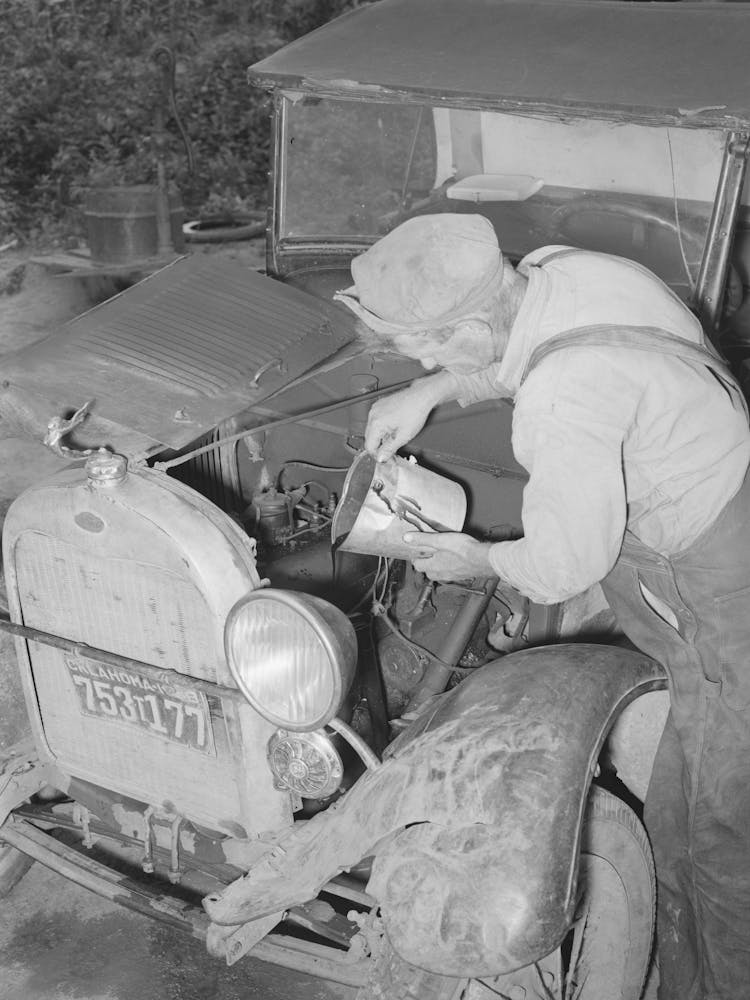 Elmer Thomas, Migrant To California, Pouring Oil Into Engine ...